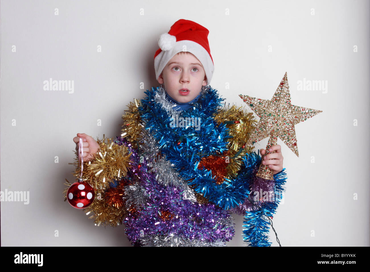 Young child dressed up as a Christmas tree Stock Photo - Alamy