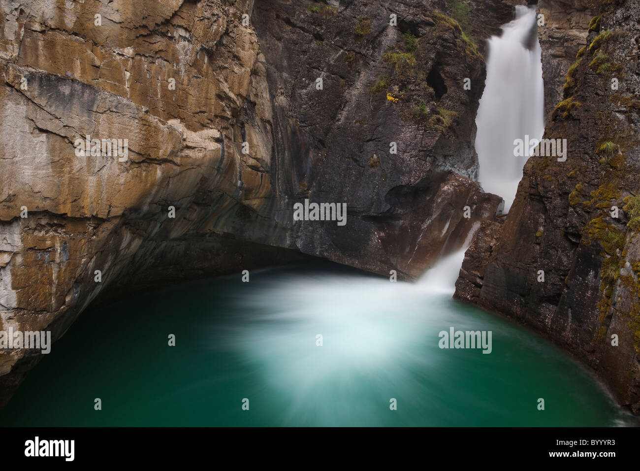 Johnston Creek's waterfalls crash down on rocks along Bow Parkway ...