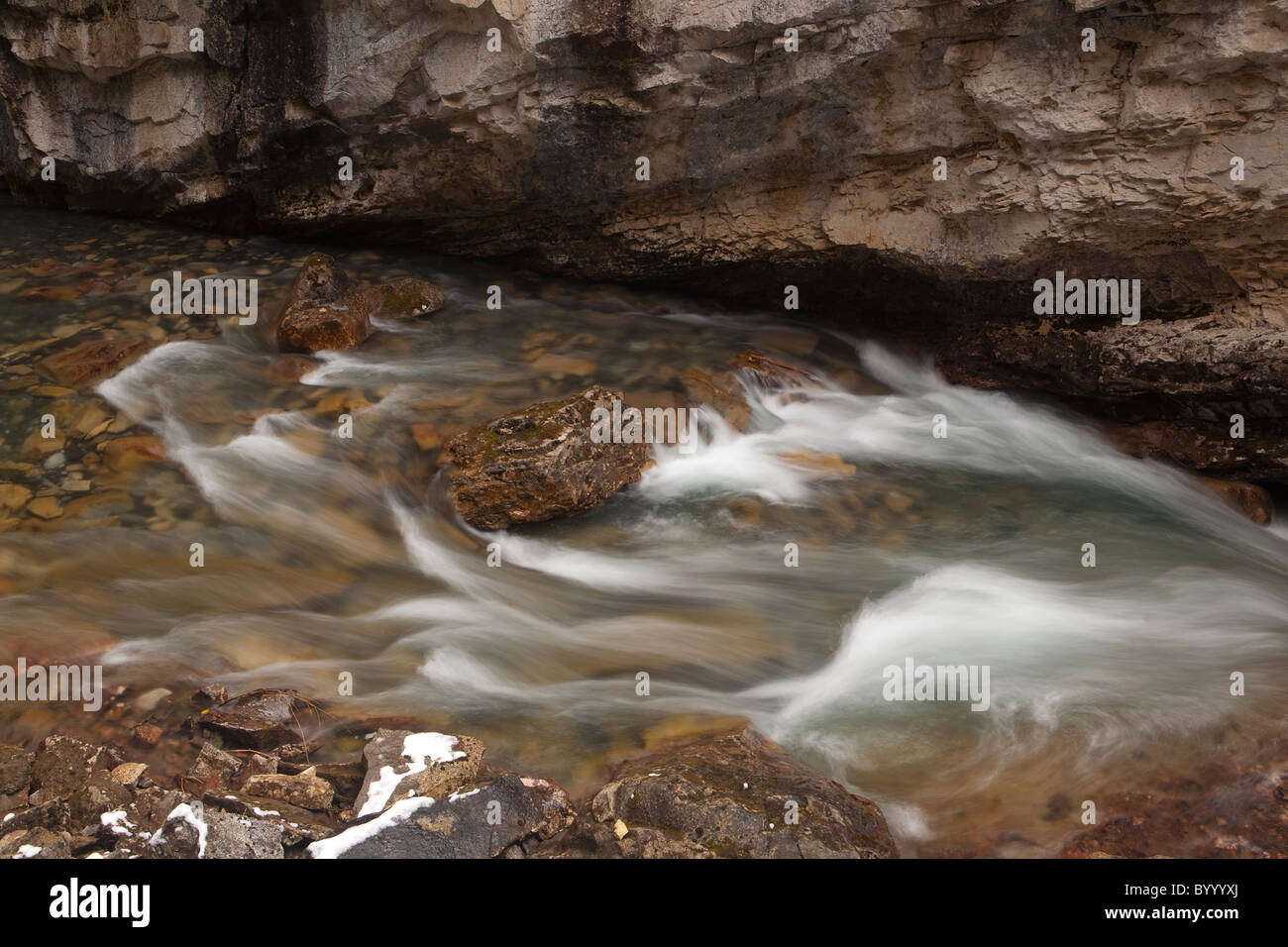 Johnston Creek's waterfalls crash down on rocks along Bow Parkway ...
