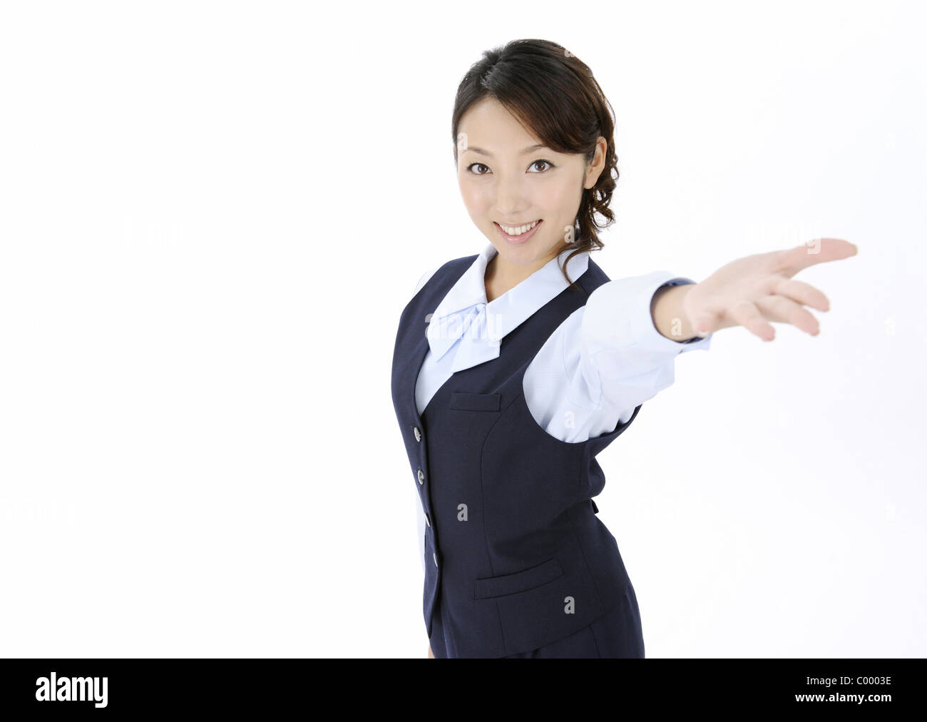 Office worker extending her arm Stock Photo - Alamy