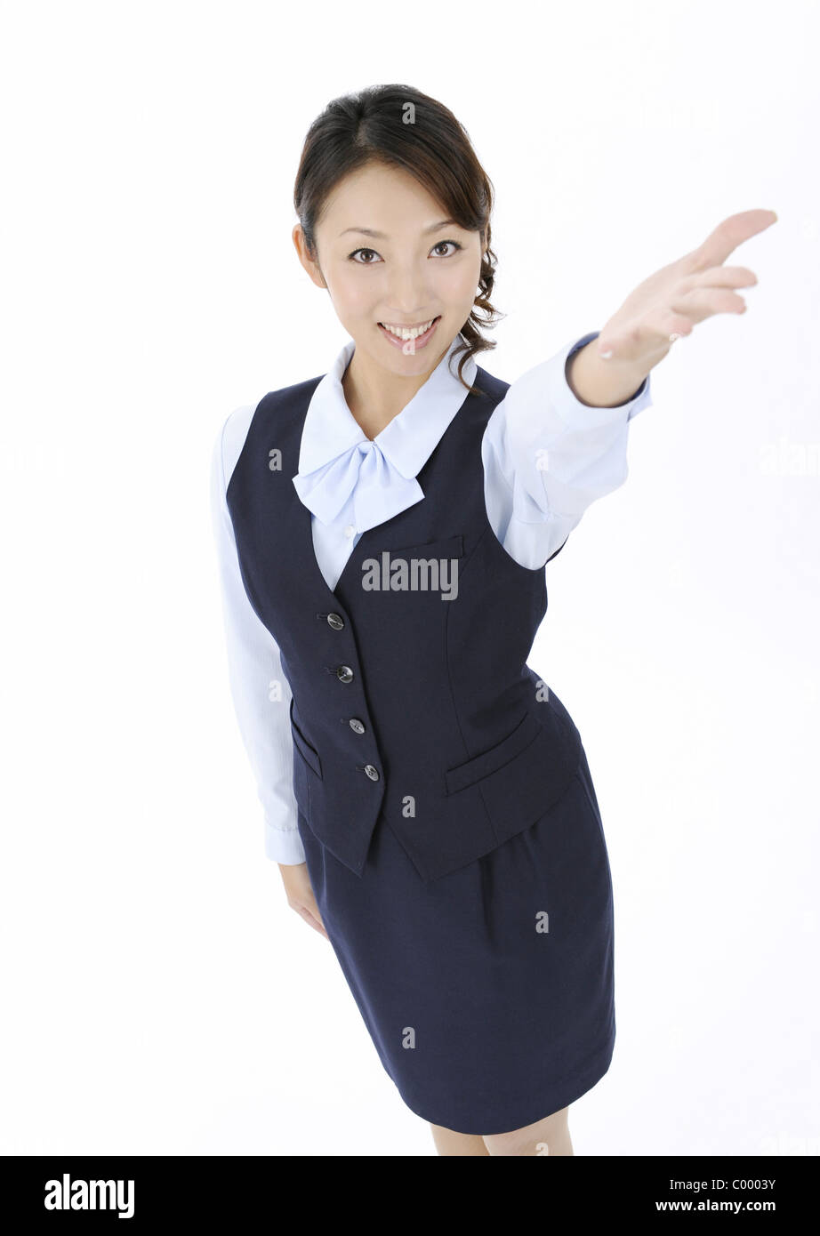 Office worker extending her arm Stock Photo - Alamy