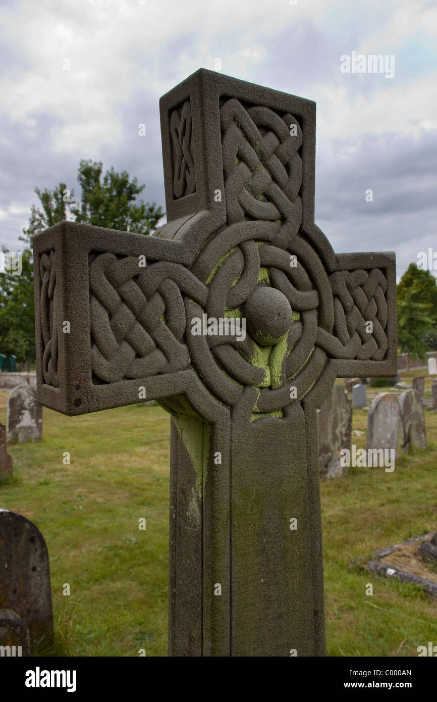 Carved stone Celtic cross headstone in graveyard of St. Margaret's ...