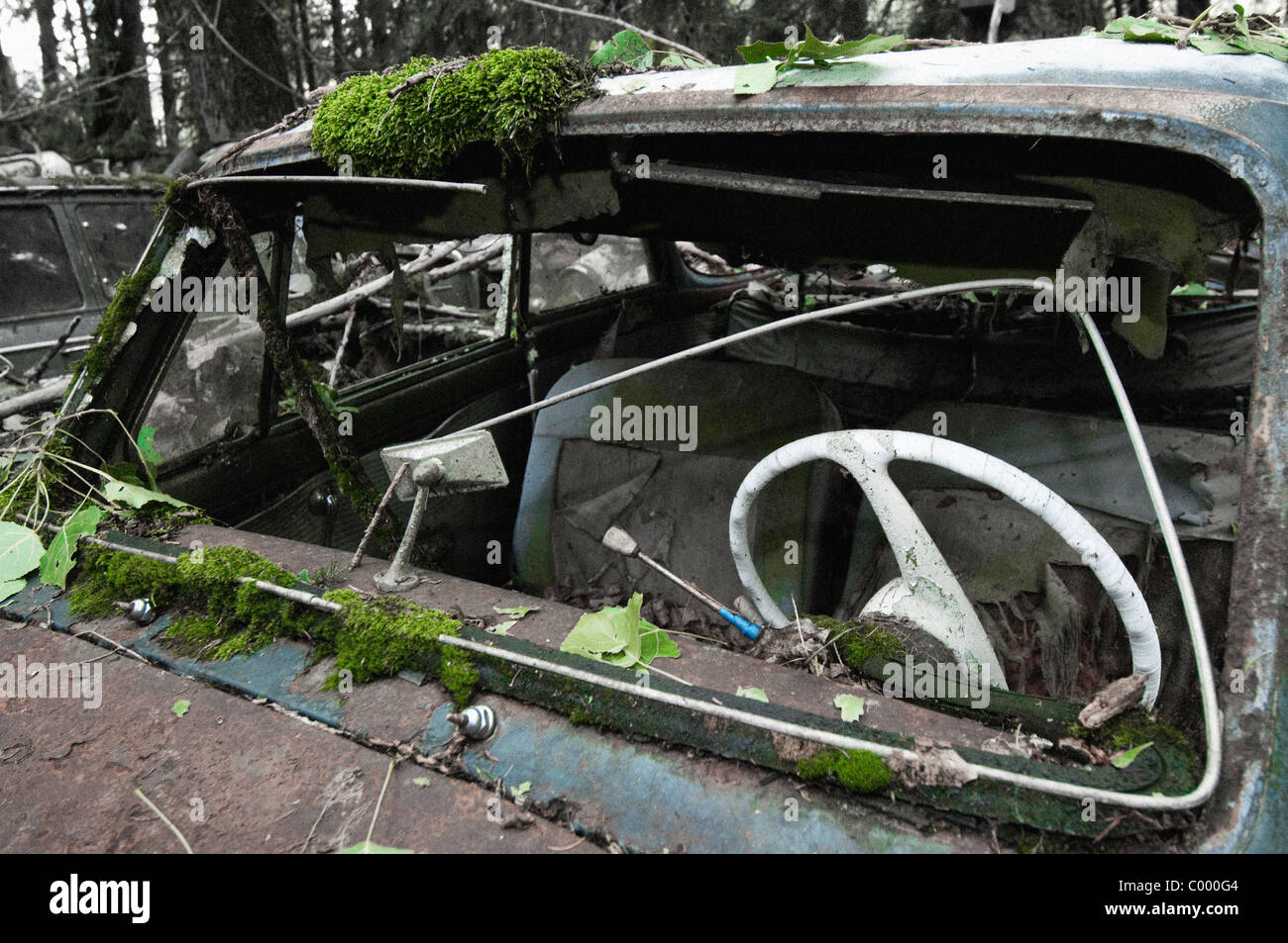 View in the rotten interior of a wrecked car at the oldtimer scrapyard ...