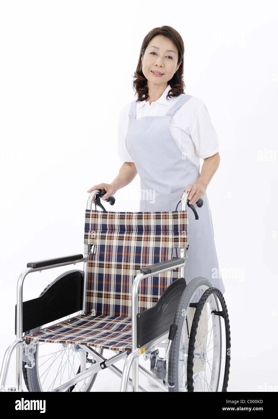 Wheelchair and home helper Stock Photo - Alamy
