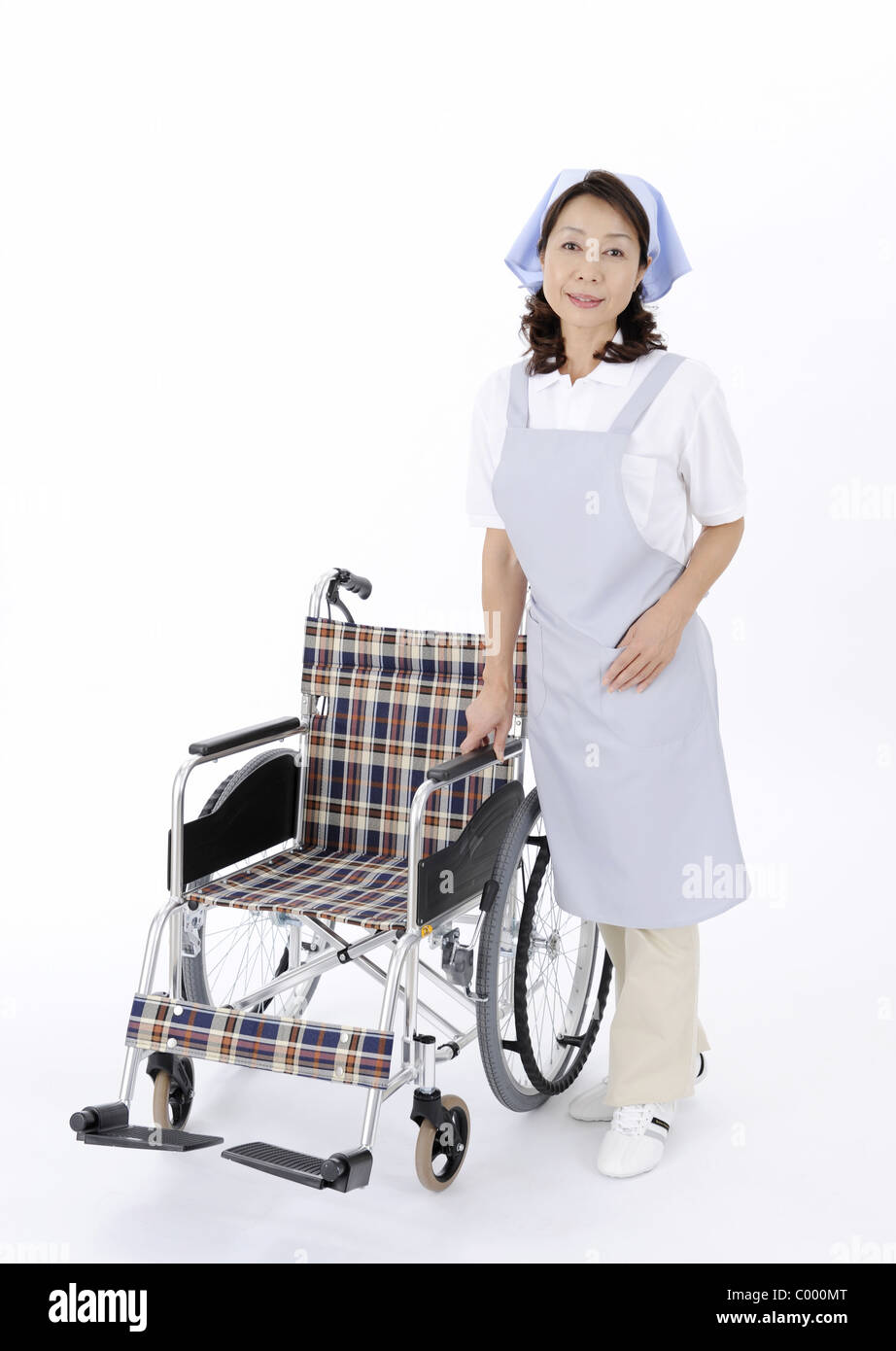 Wheelchair and home helper Stock Photo - Alamy