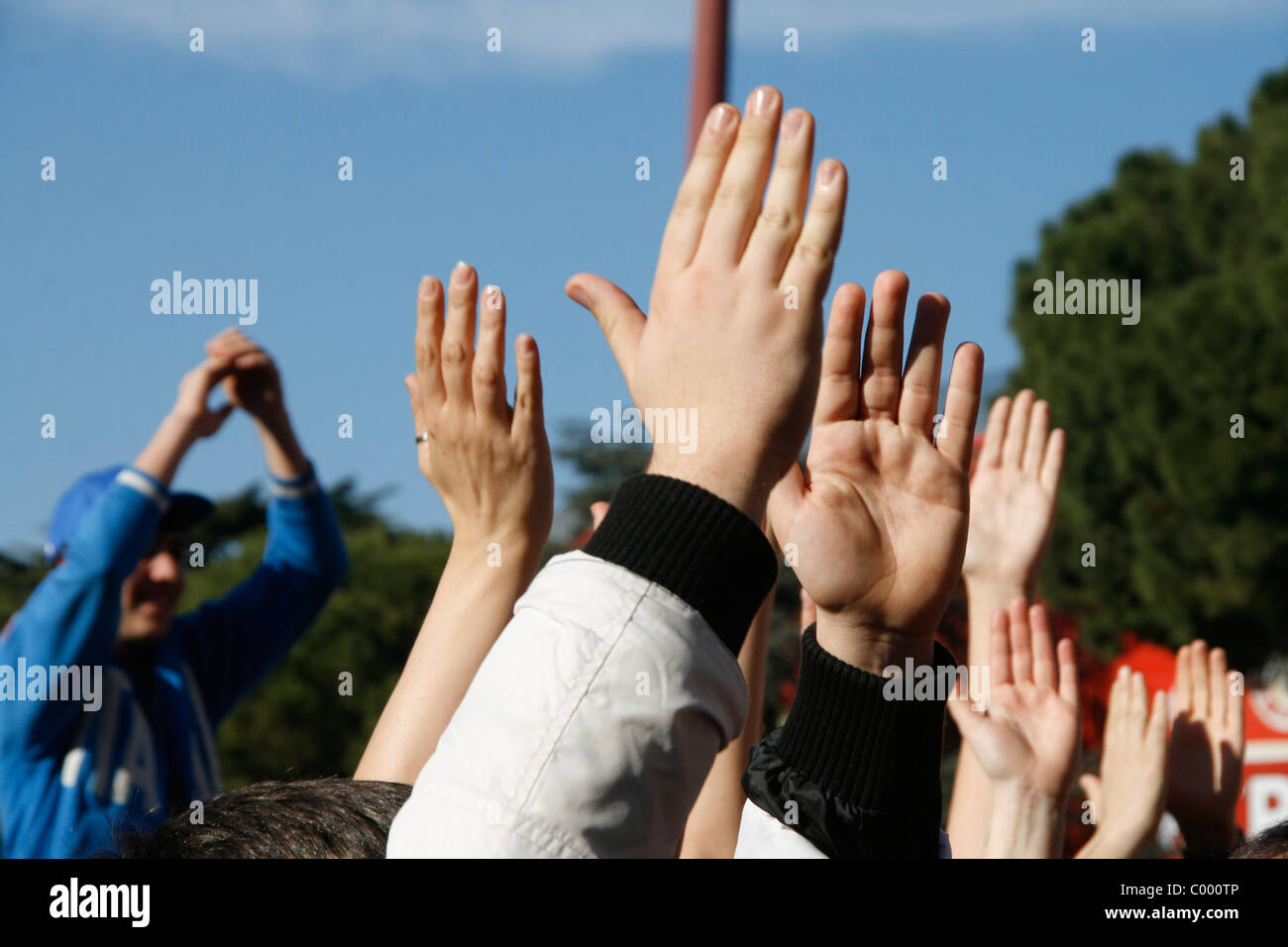 people with raised hands at outdoors event Stock Photo - Alamy