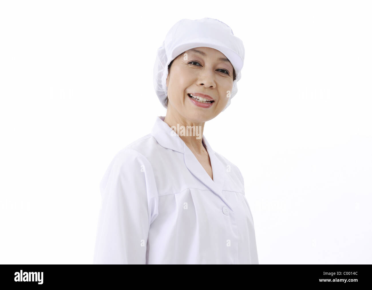 Smiling factory worker Stock Photo - Alamy