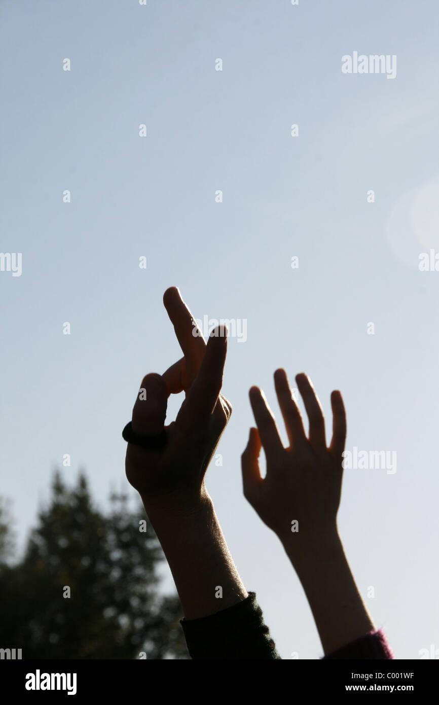 two people with arms raised at event outdoors Stock Photo - Alamy