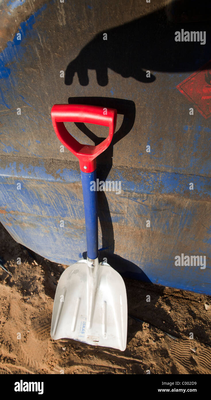 Spade and a shadow image of a hand , Finland Stock Photo - Alamy