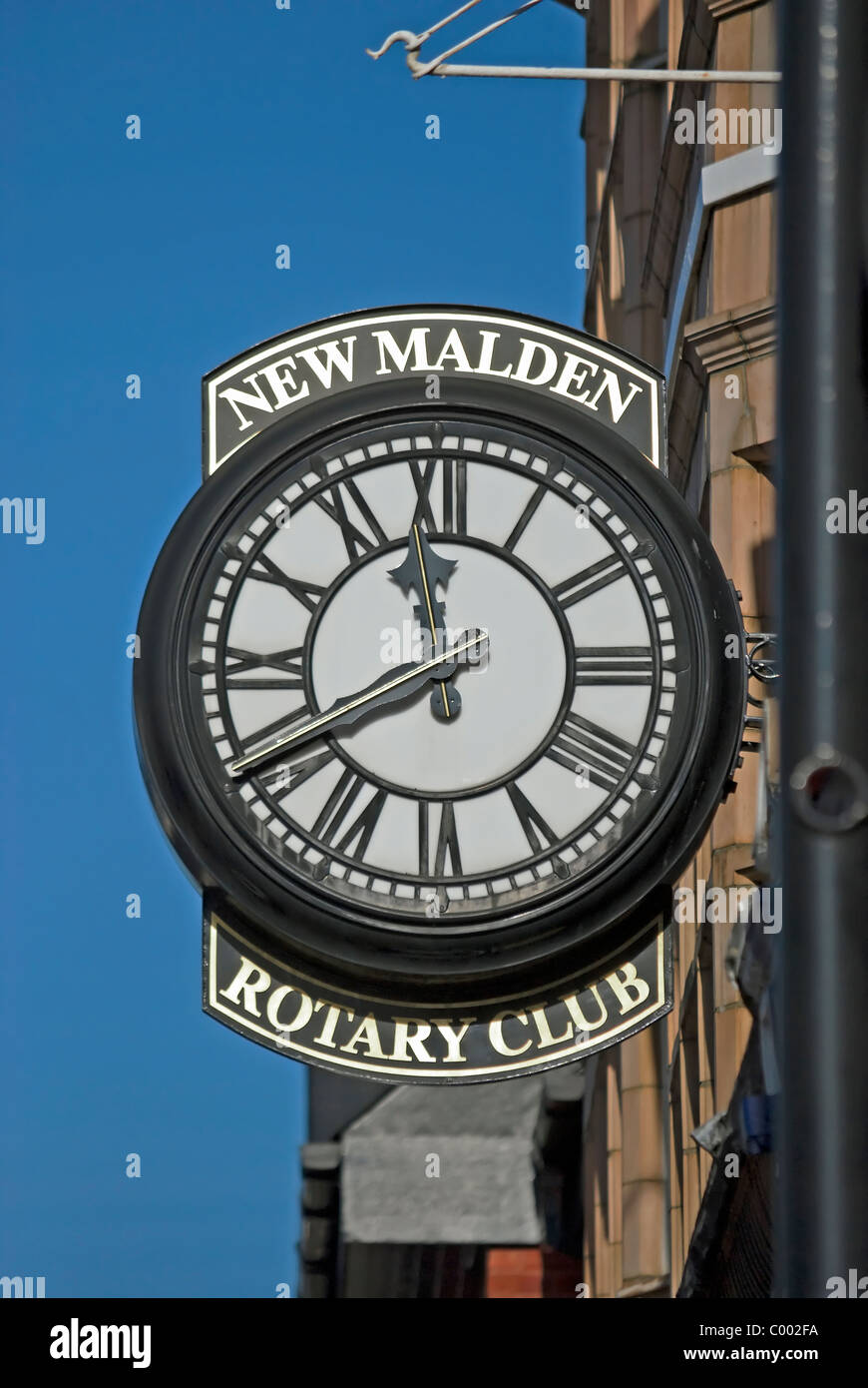 clock with roman numerals outside the rotary club of new malden, surrey ...