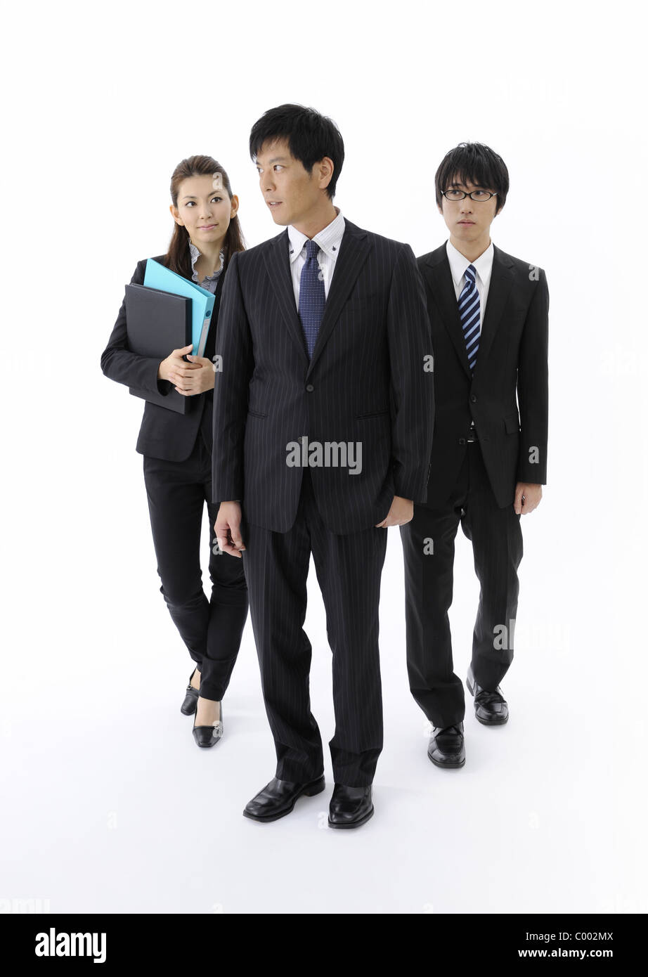 Business team walking Stock Photo - Alamy