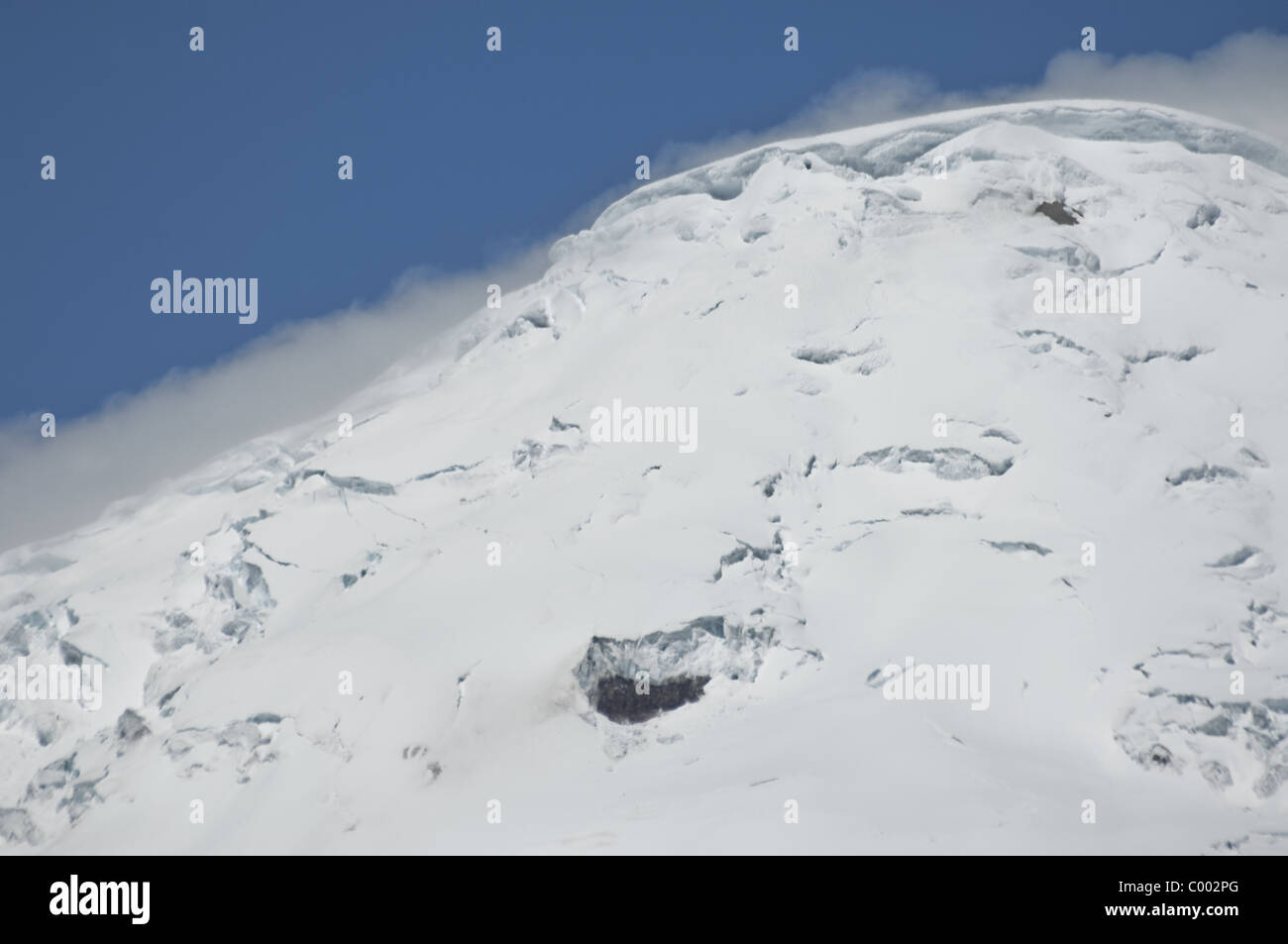 Snow covered volcanoes towering above the sierra in Ecuador Stock Photo ...