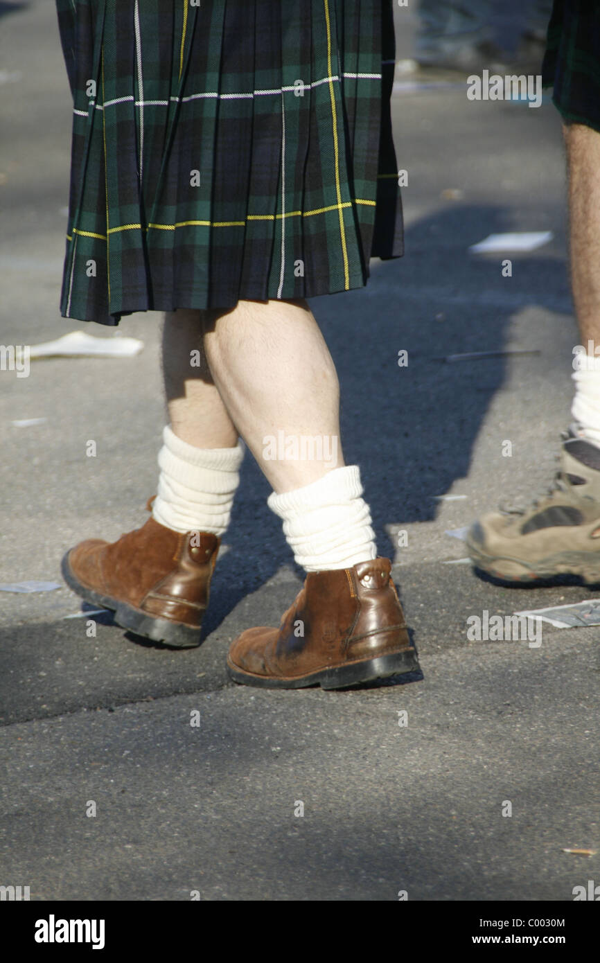 person scottish man wearing kilt feet legs walking in street in town ...