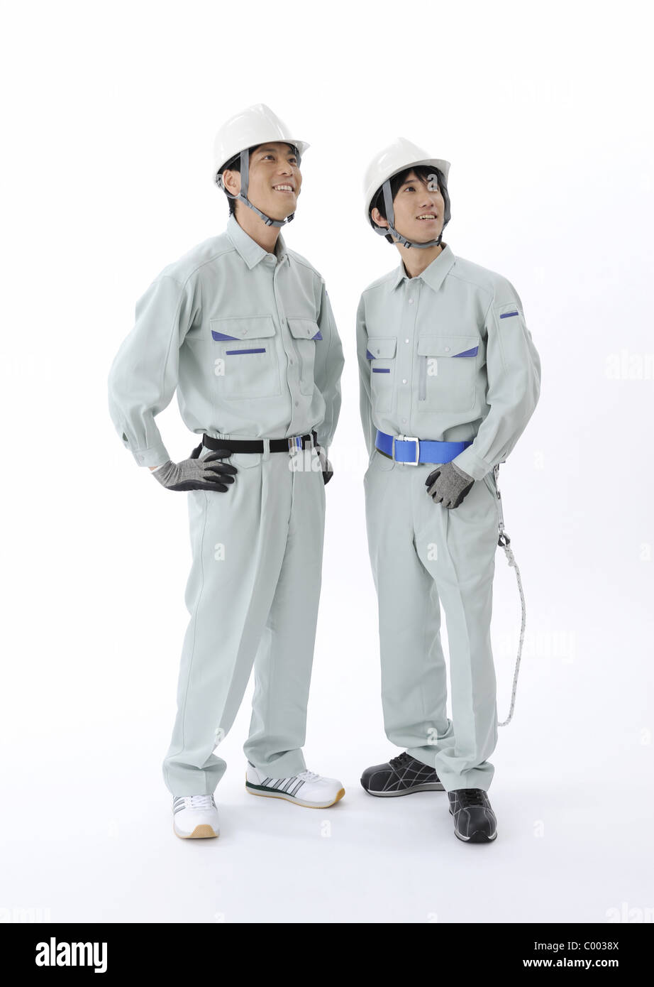 Construction workers looking up Stock Photo - Alamy