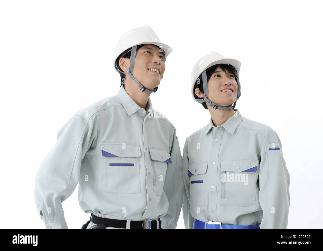 Construction workers looking up Stock Photo - Alamy