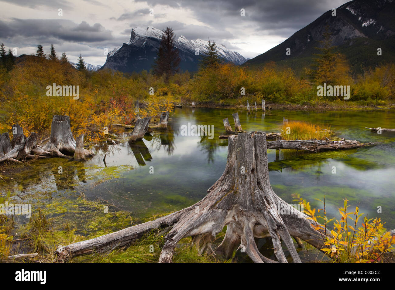 Storm clouds and Mountain Range Reflected on Still Lake, Sunrise at ...