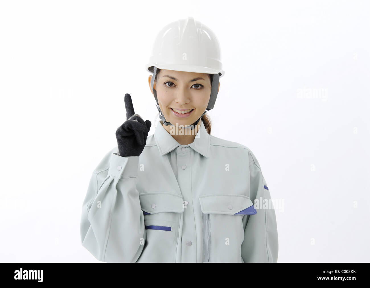Construction worker pointing with her finger Stock Photo - Alamy