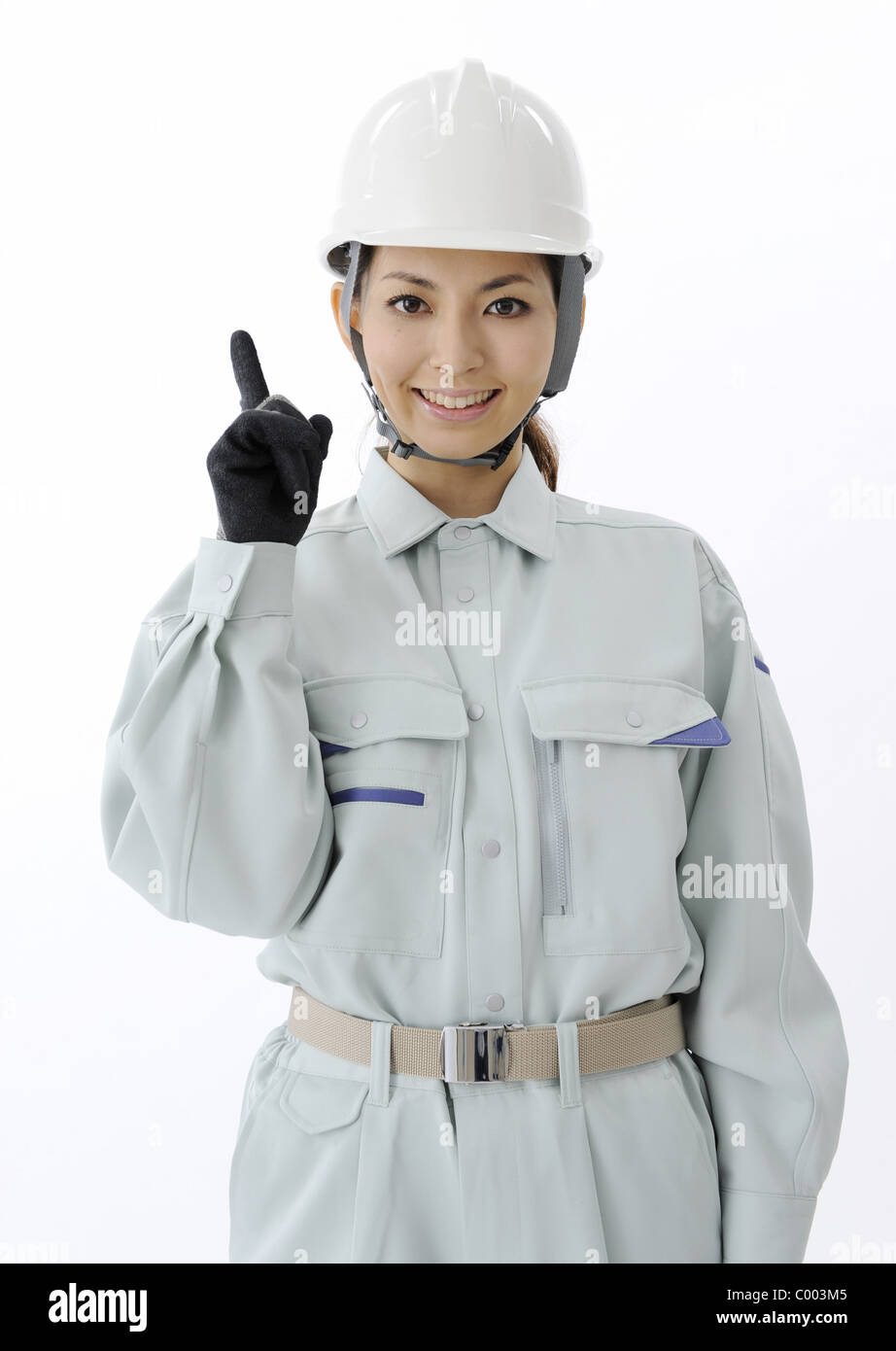 Construction worker pointing with her finger Stock Photo - Alamy