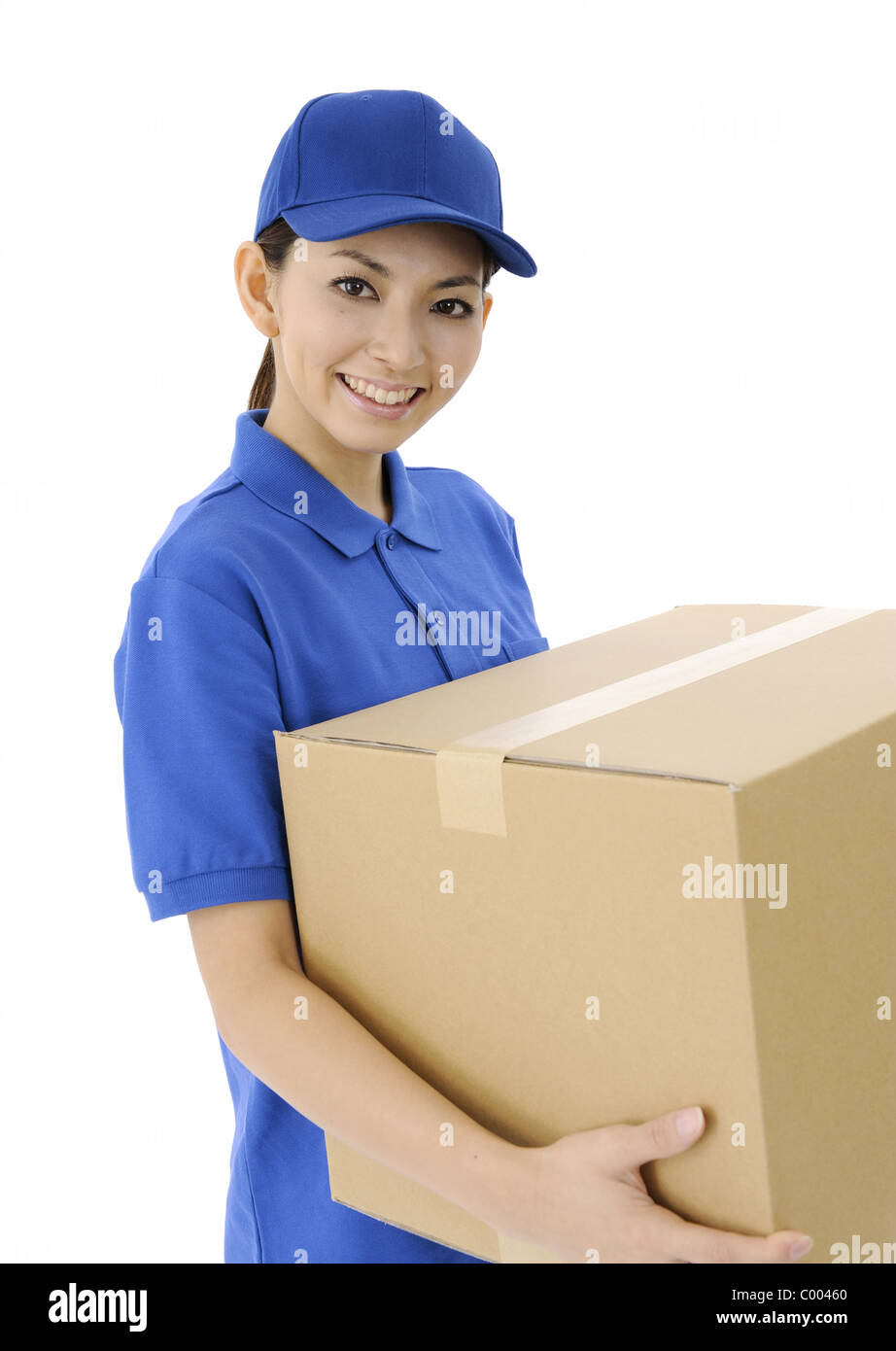 Deliverer carrying box Stock Photo - Alamy
