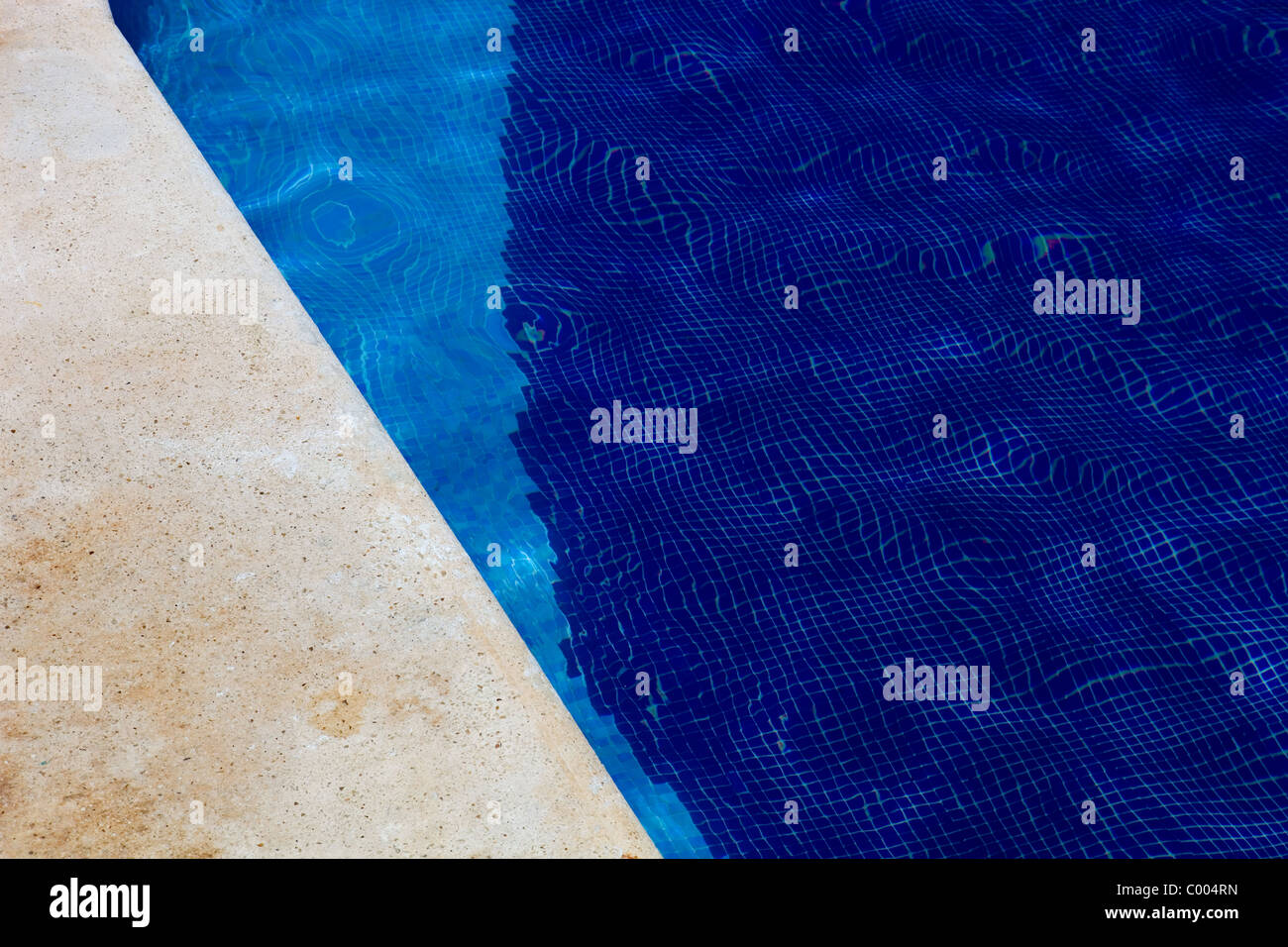 swimming pool blue water detail in summer time Stock Photo - Alamy