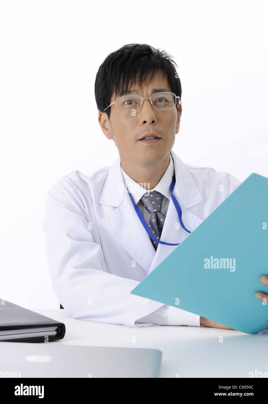 Lab worker holding file Stock Photo - Alamy