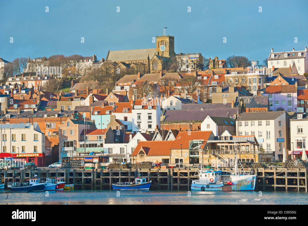 A coastal seaside community with harbor and church Stock Photo - Alamy