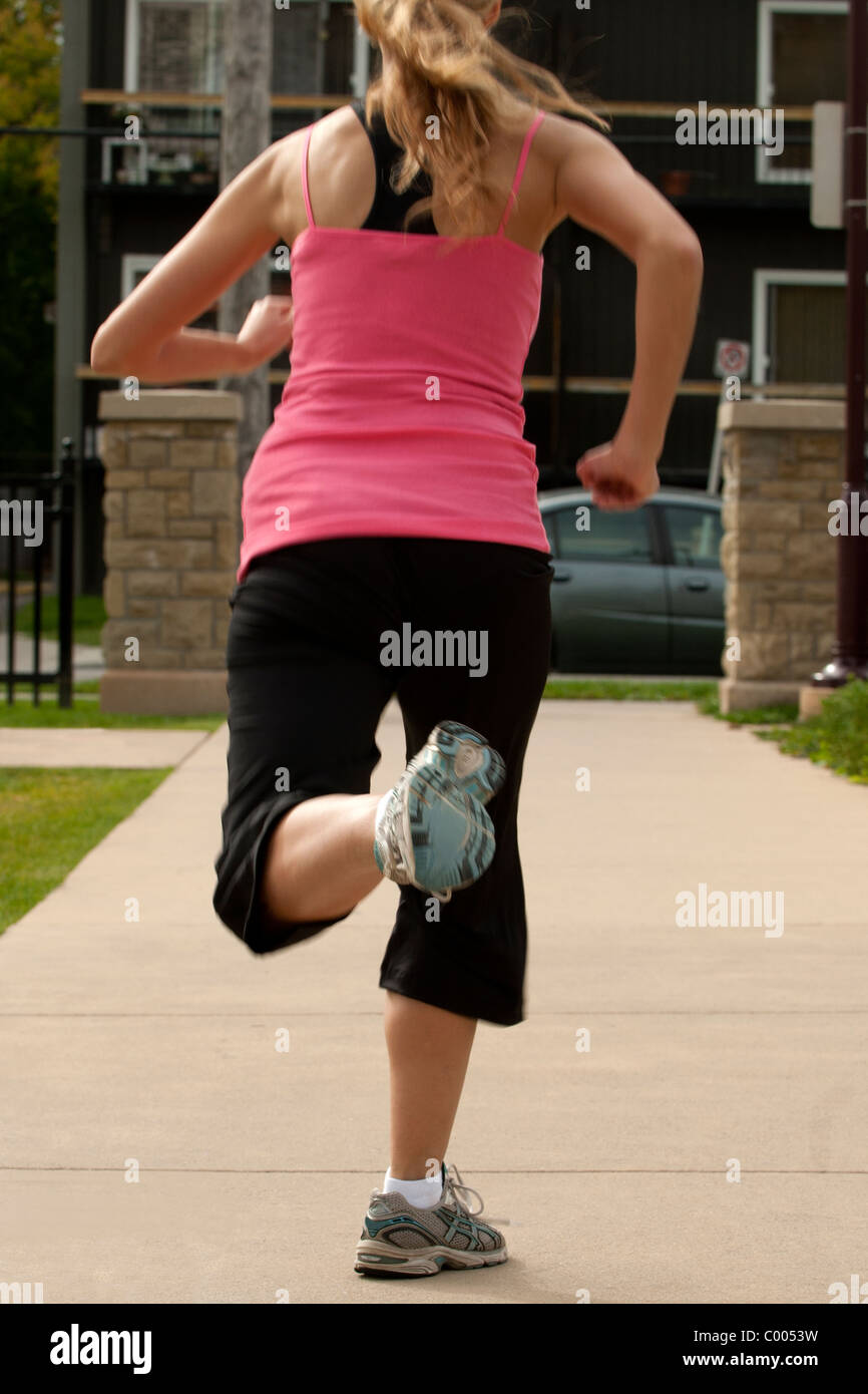 Outdoor spring training exercise in city park showing beautiful young ...