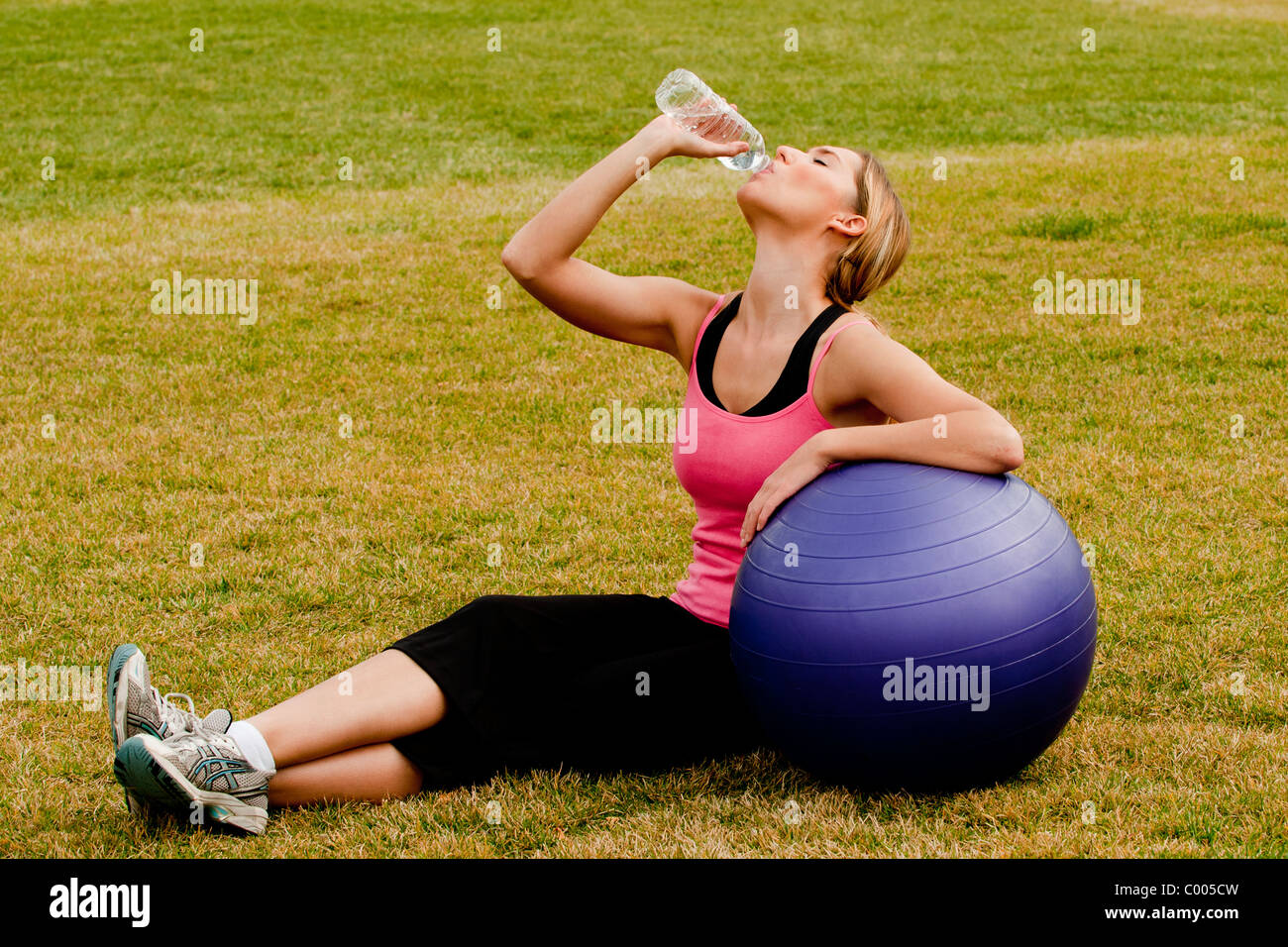 Outdoor spring training exercise in city park showing beautiful young ...