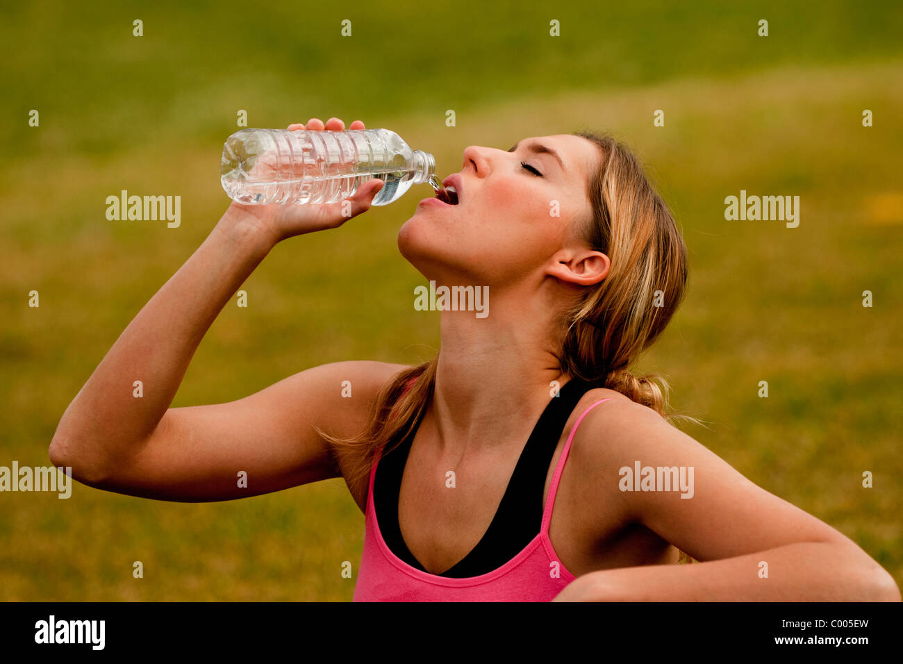 Outdoor spring training exercise in city park showing beautiful young ...