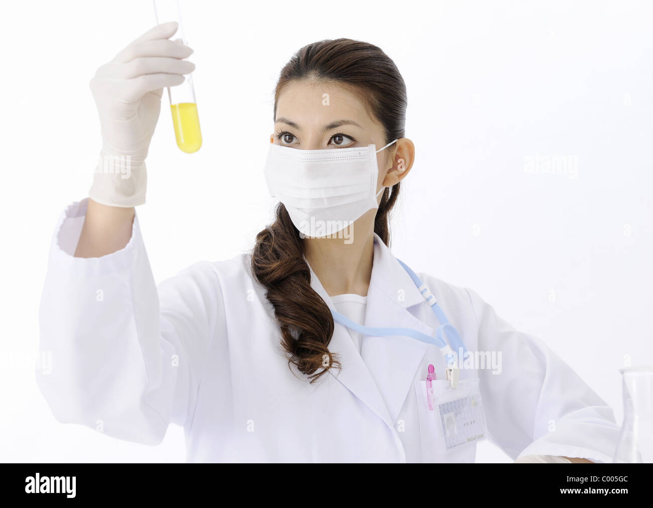 Lab worker experimenting Stock Photo - Alamy