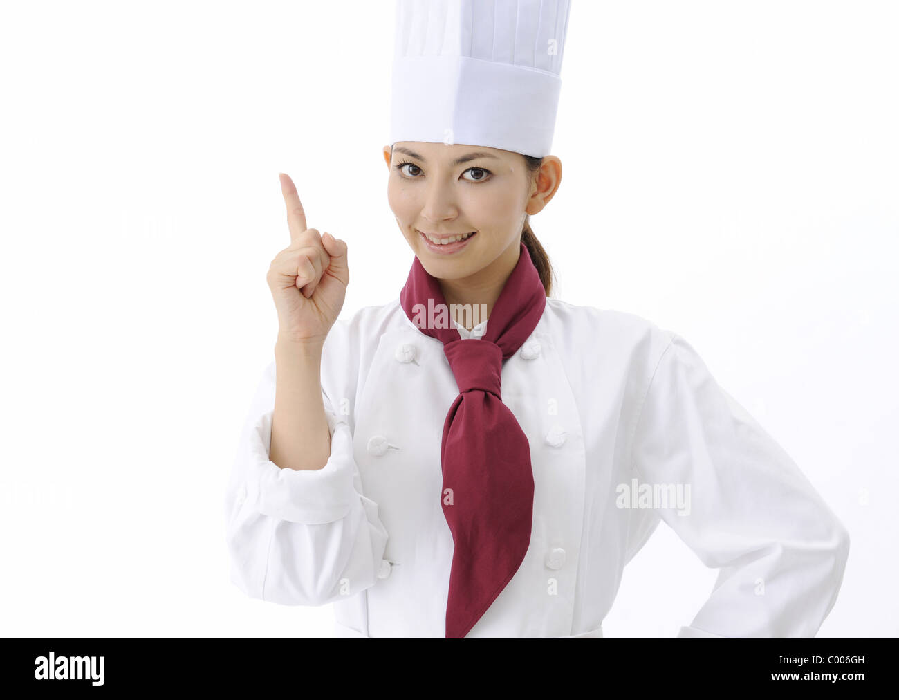 Cook pointing with her finger Stock Photo - Alamy