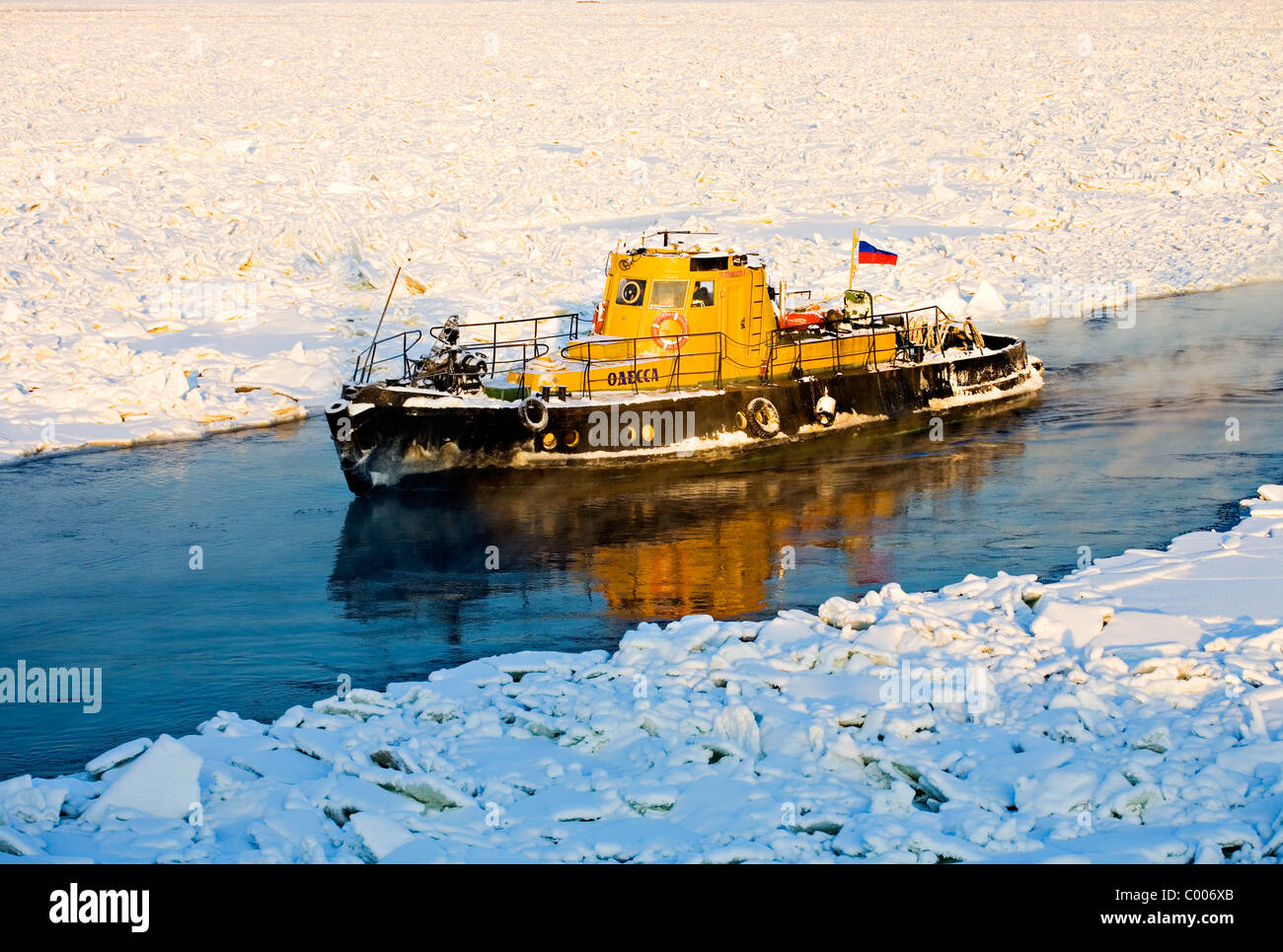 Ice breaker on frozen Neva river with Peter and Paul Fortress in ...