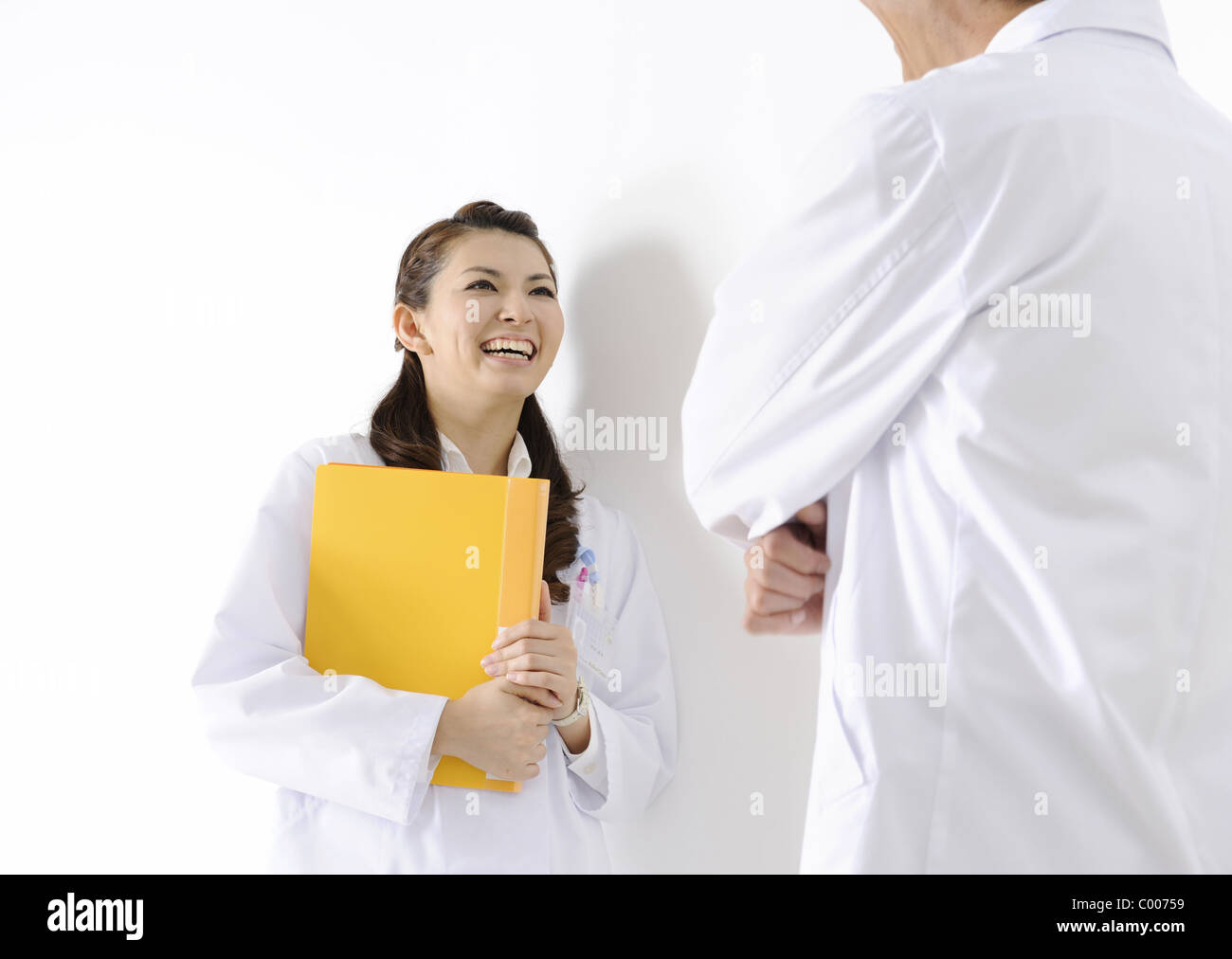 Lab workers talking Stock Photo - Alamy
