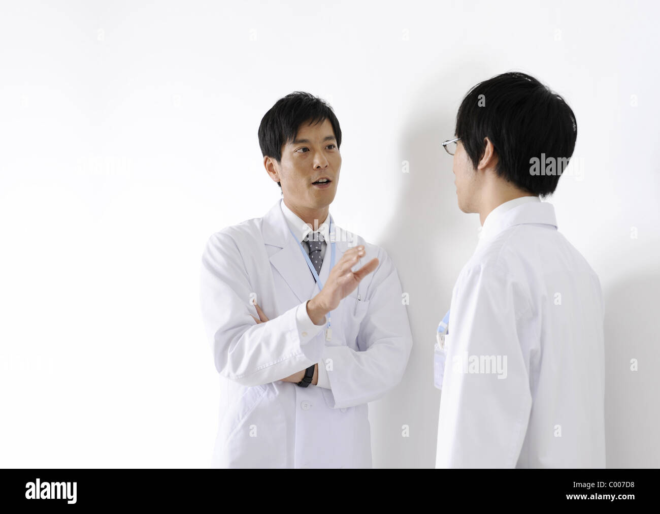 Lab workers talking Stock Photo - Alamy