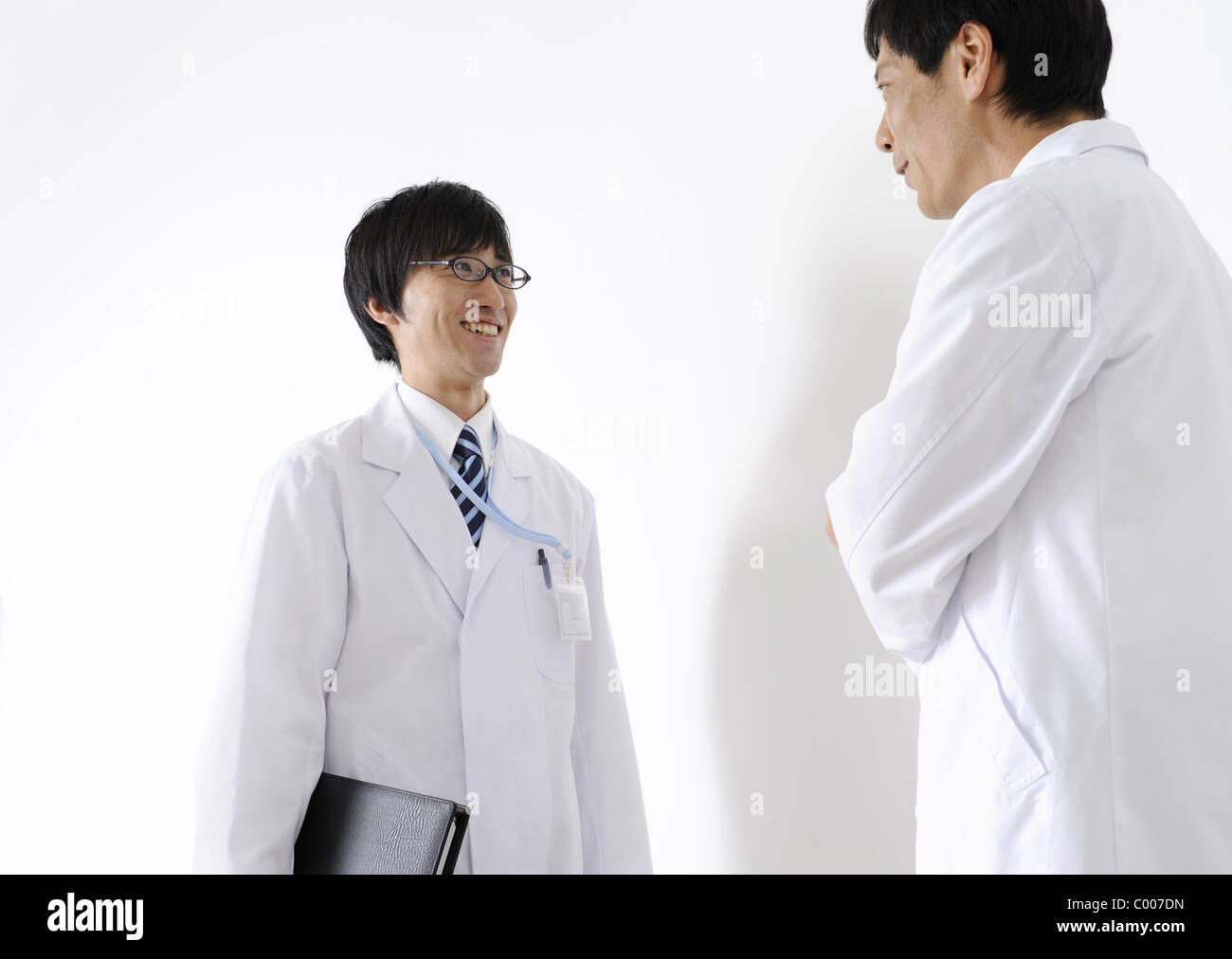 Lab workers talking Stock Photo - Alamy