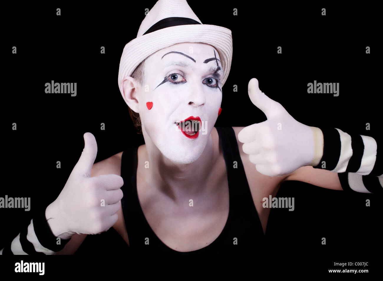 Funny screaming mime in white hat isolated on black background Stock ...