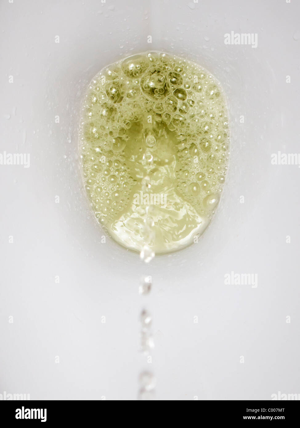 Peeing in a water closet Stock Photo - Alamy