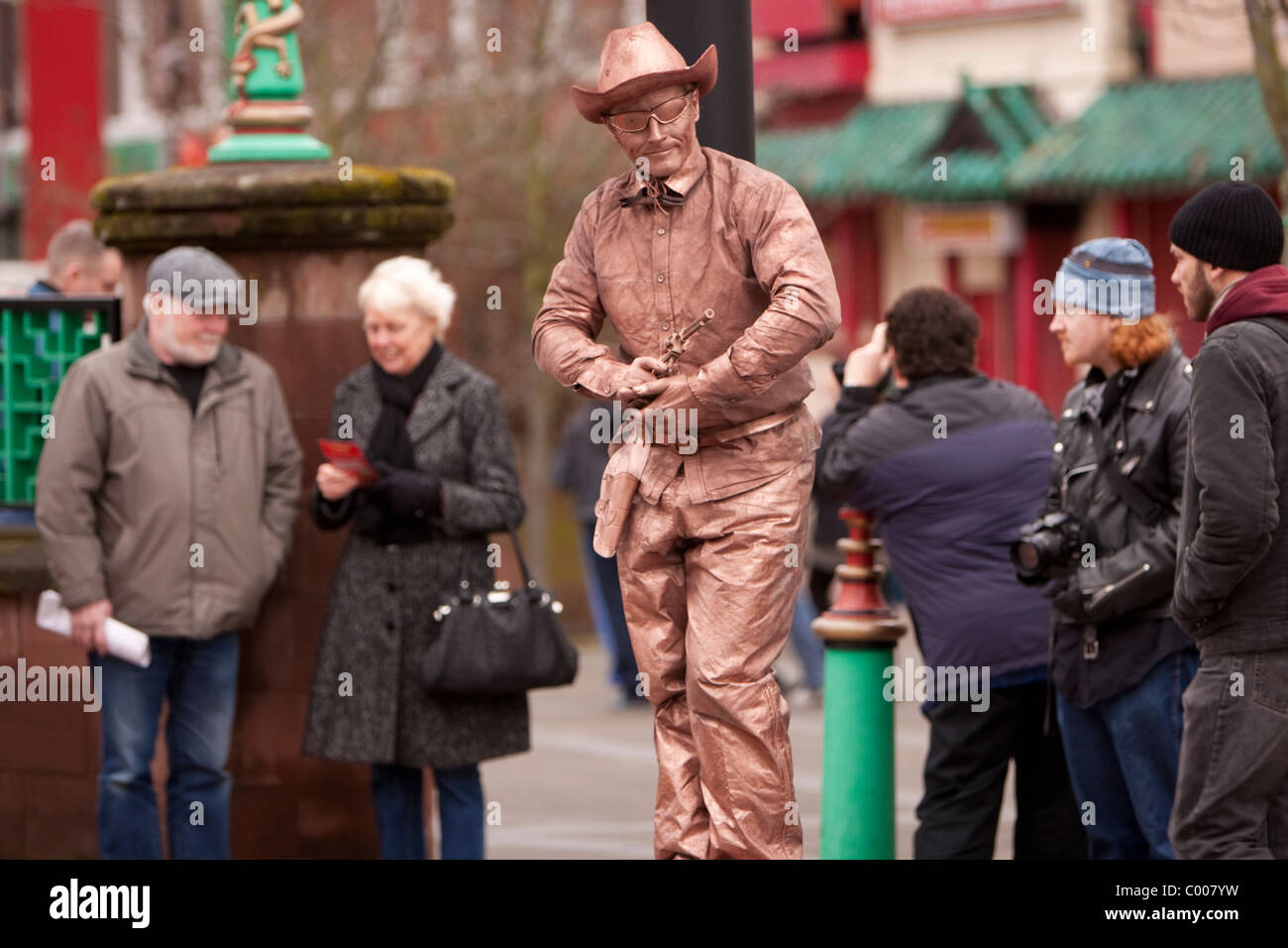 A Human Statue in Chinatown, Liverpool Stock Photo - Alamy
