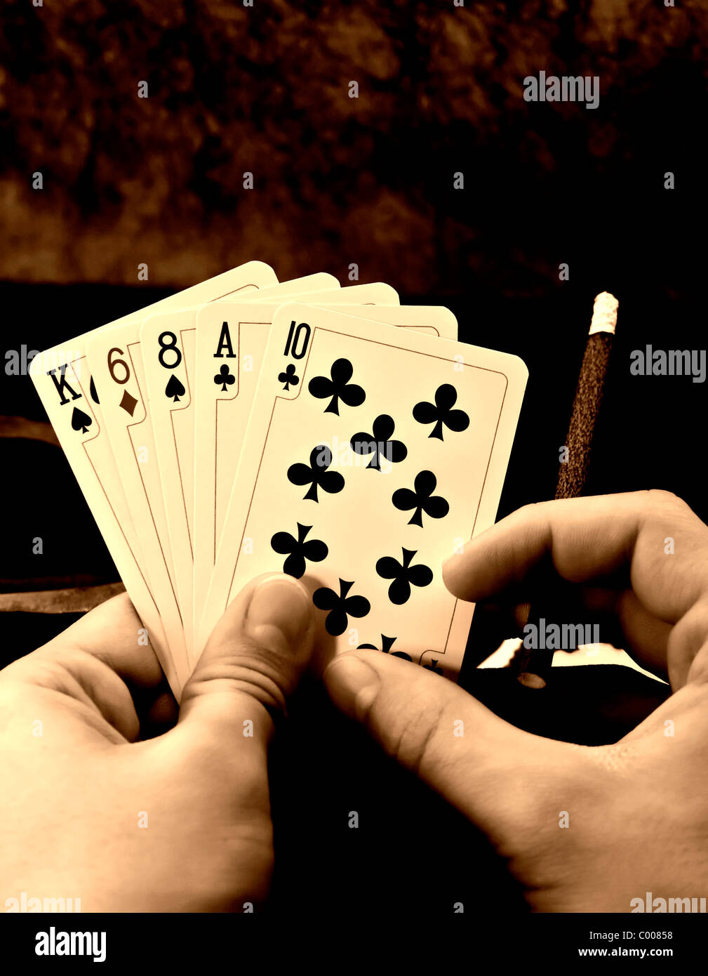 Playing cards in a hand Stock Photo - Alamy