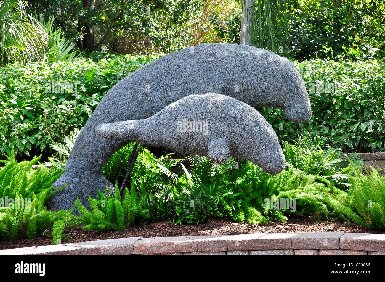 Manatee shaped bush at Sea World Stock Photo - Alamy
