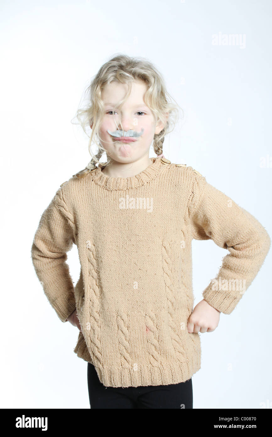A blond girl with a grey moustache stuck on, hands on hips and looking ...