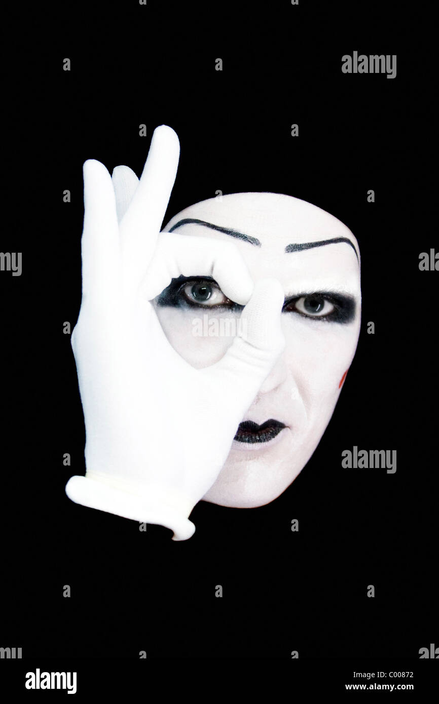Portrait of the mime in white gloves on a black background Stock Photo ...