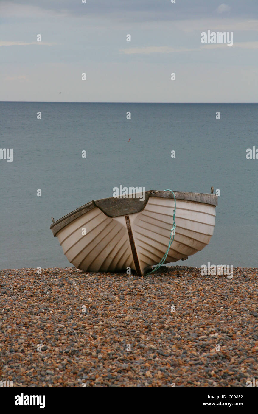 boat on a pebble beach Stock Photo - Alamy