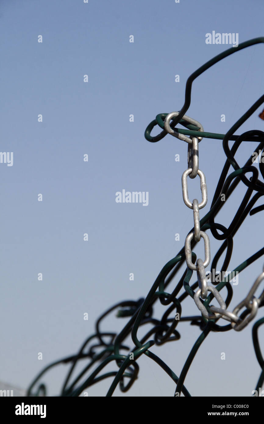 metal chain on top of fence outdoors in sun Stock Photo - Alamy