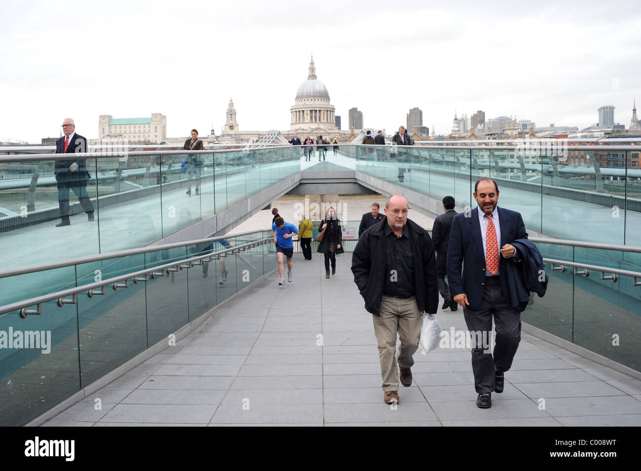 People walking over Millennium Bridge, London Stock Photo - Alamy
