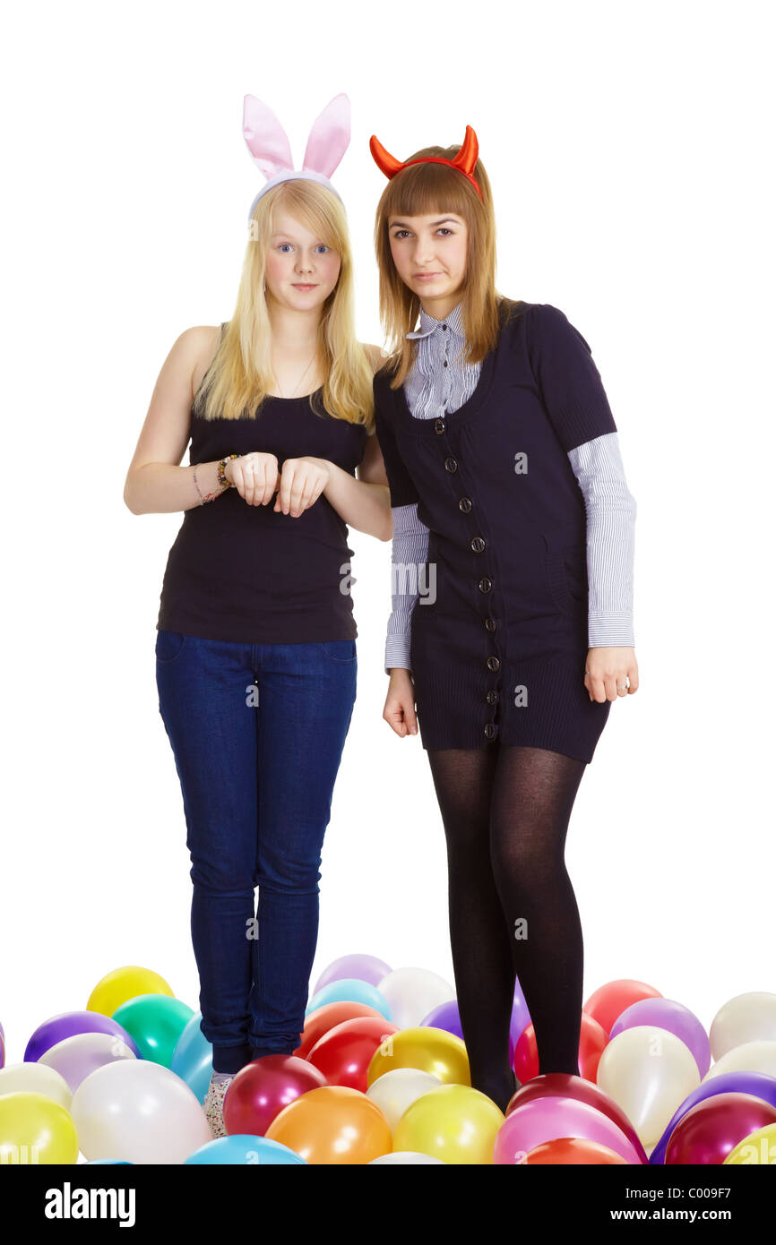 two attractive girls in the costumes of the hare and the devil. White ...