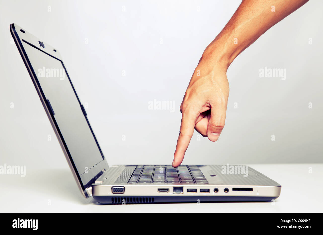 hand gesture next to a laptop with cross processing effect (selective ...