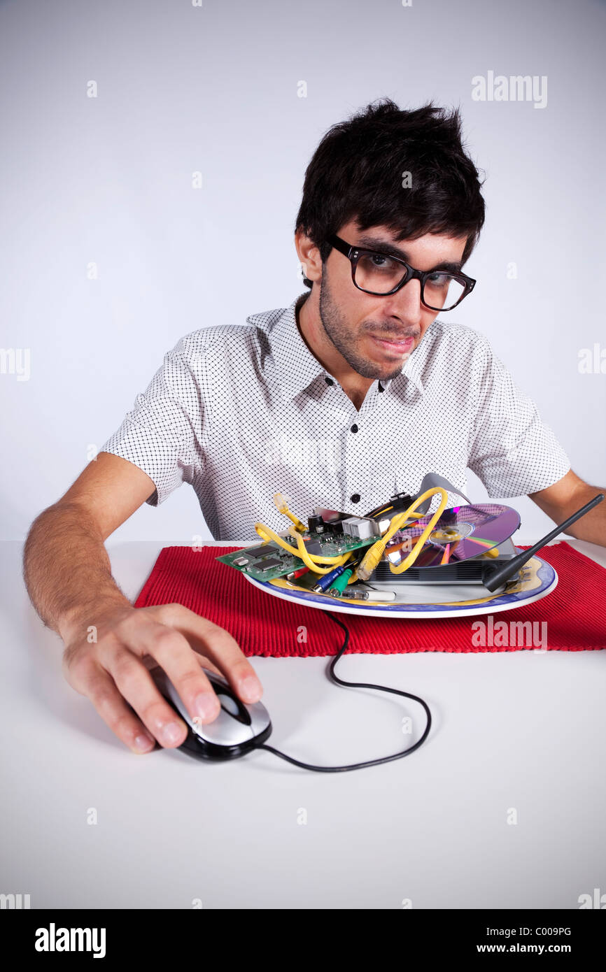 Crazy young man eating technology hi-res stock photography and images ...