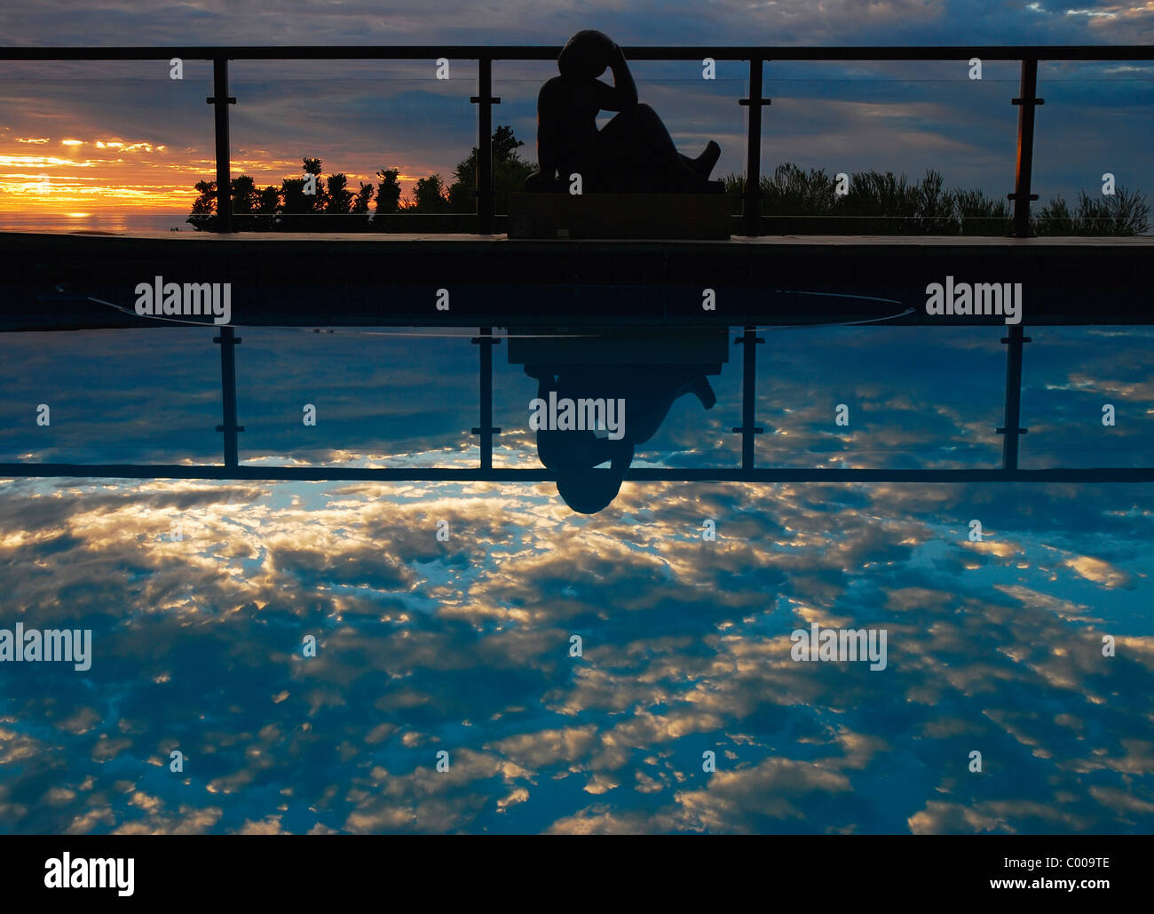 Woman Reflected In Swimming Pool At Dusk Stock Photo - Alamy