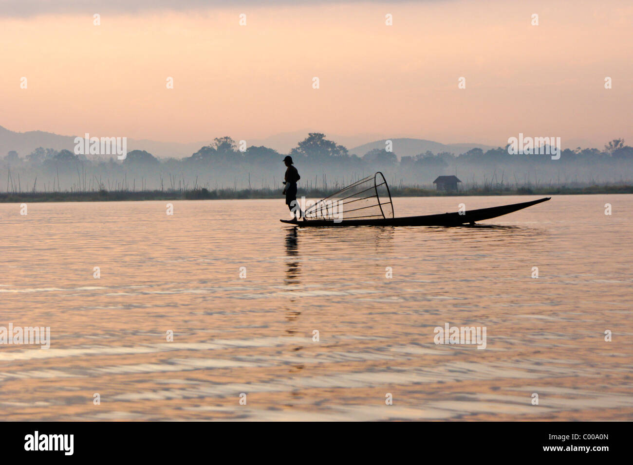 Intha leg-rowing fisherman on Inle Lake at sunrise, Myanmar (Burma ...